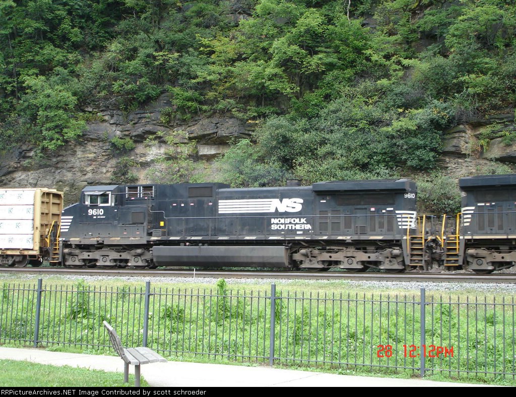 NS 9610 trails long hood forward EB around the curve